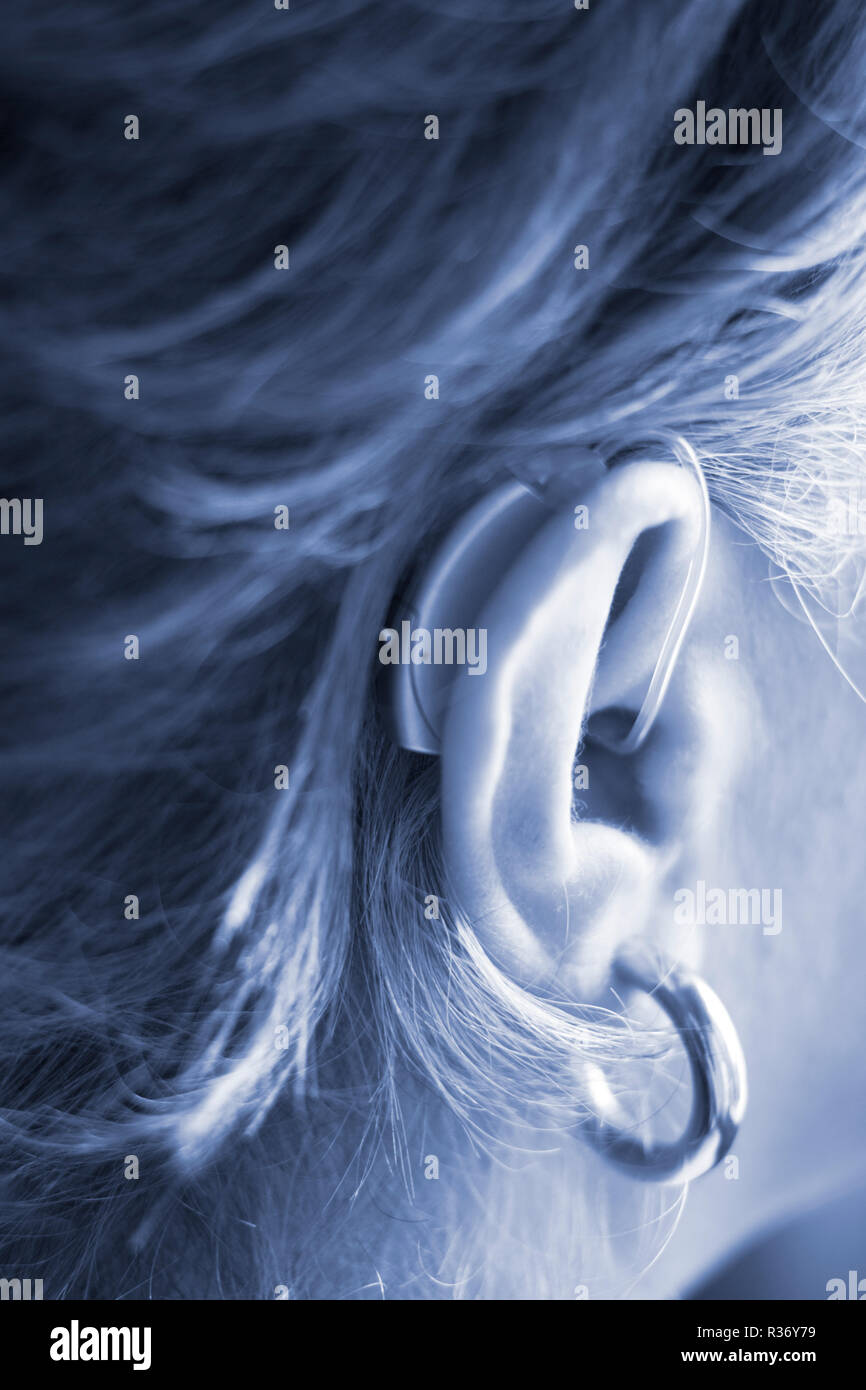 Deaf lady with modern technology digital hearing aid in her ear Stock ...