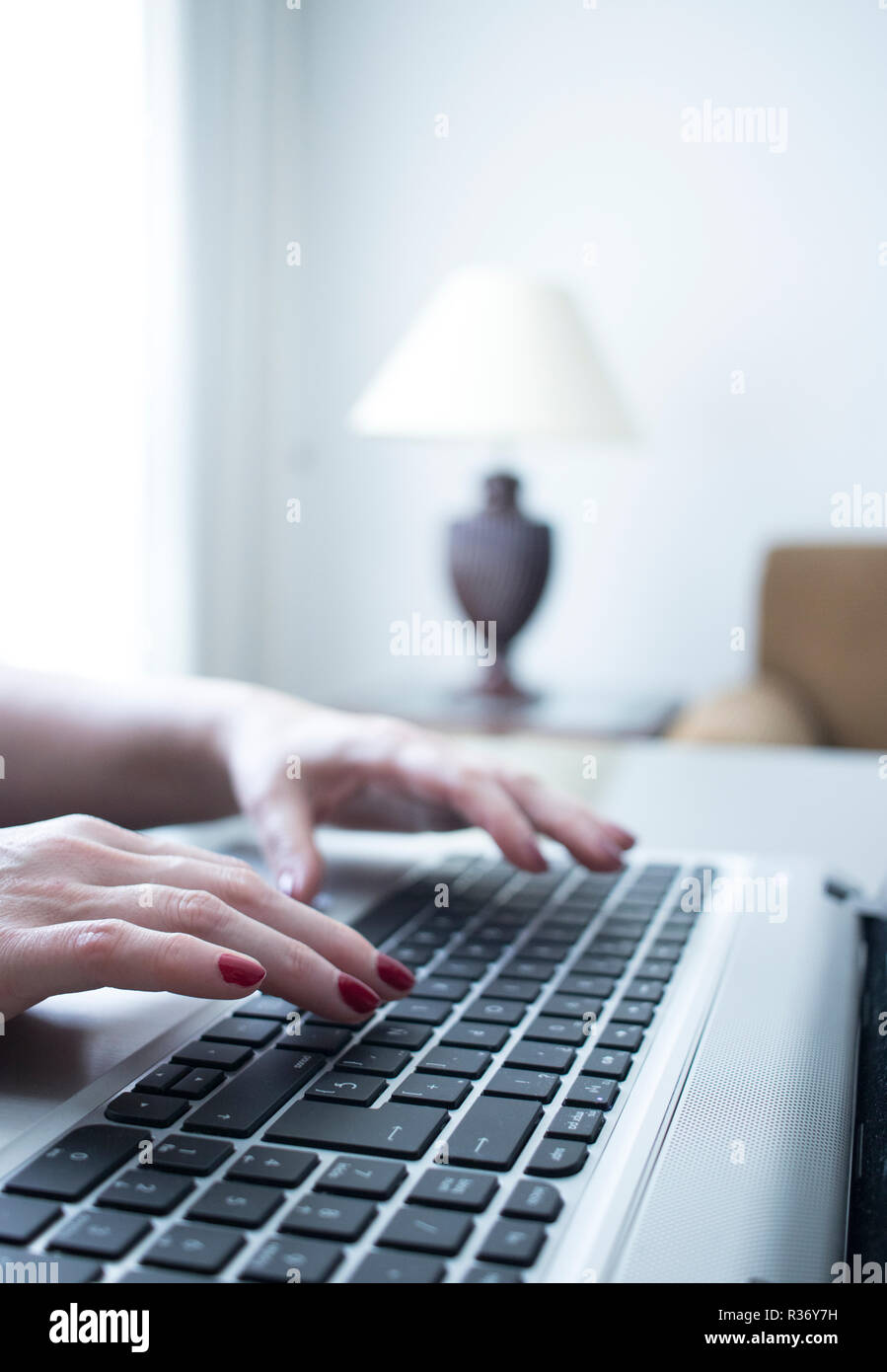 Secretary typist typing on laptop pc computer keyboard keys with hands ...