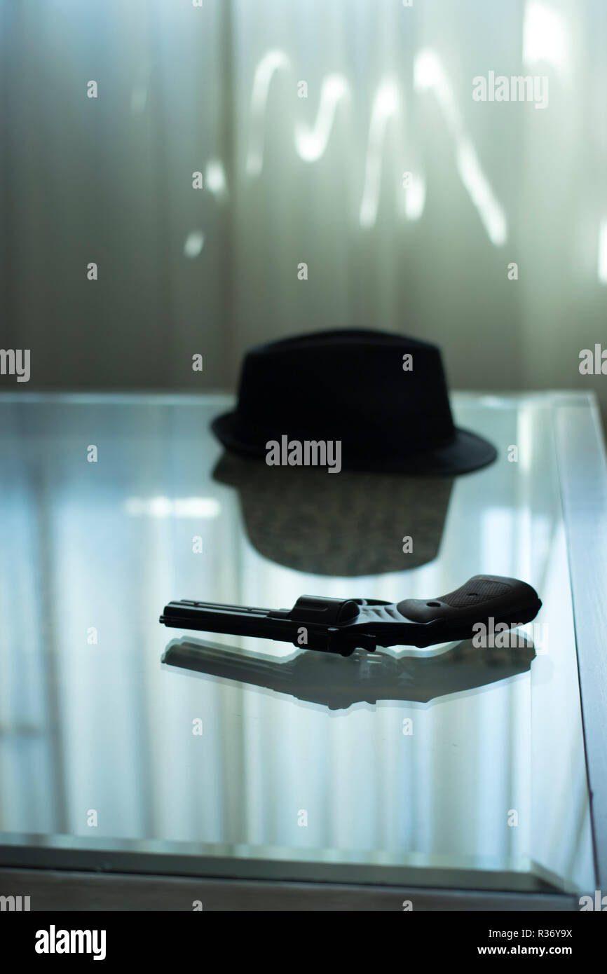 Automatic pistol gun on glass table in bedroom in luxury hotel in ...