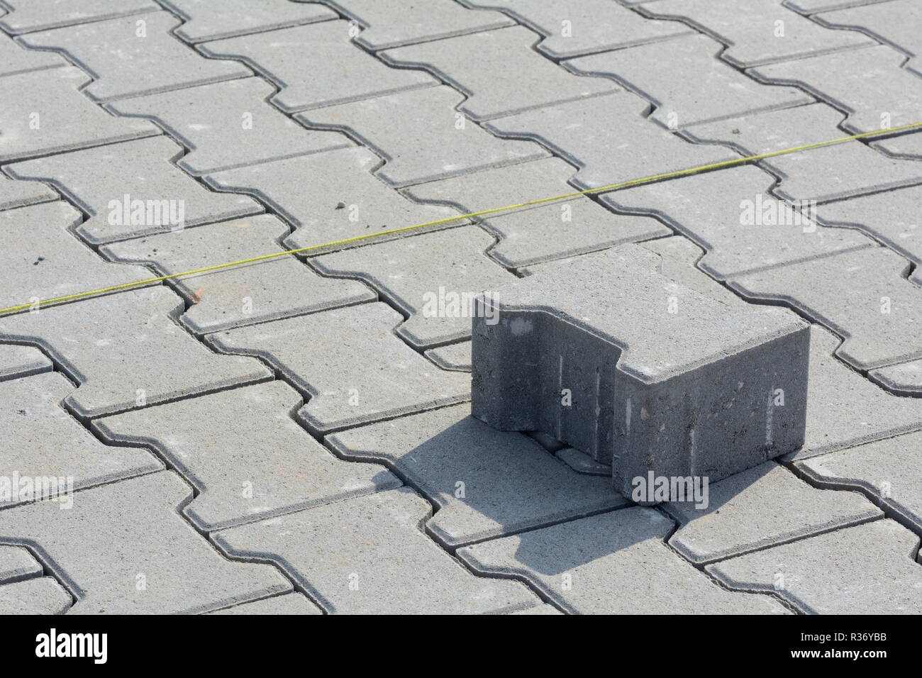 laying of interlocking paving stones Stock Photo - Alamy