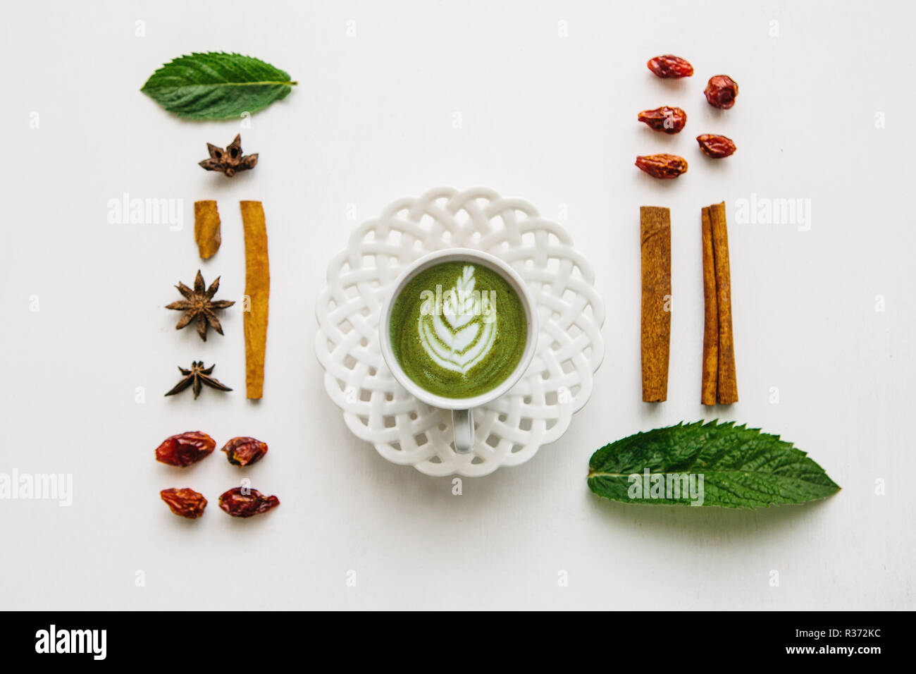 Flat lay a cup of fresh useful green matcha latte coffee on a white ...