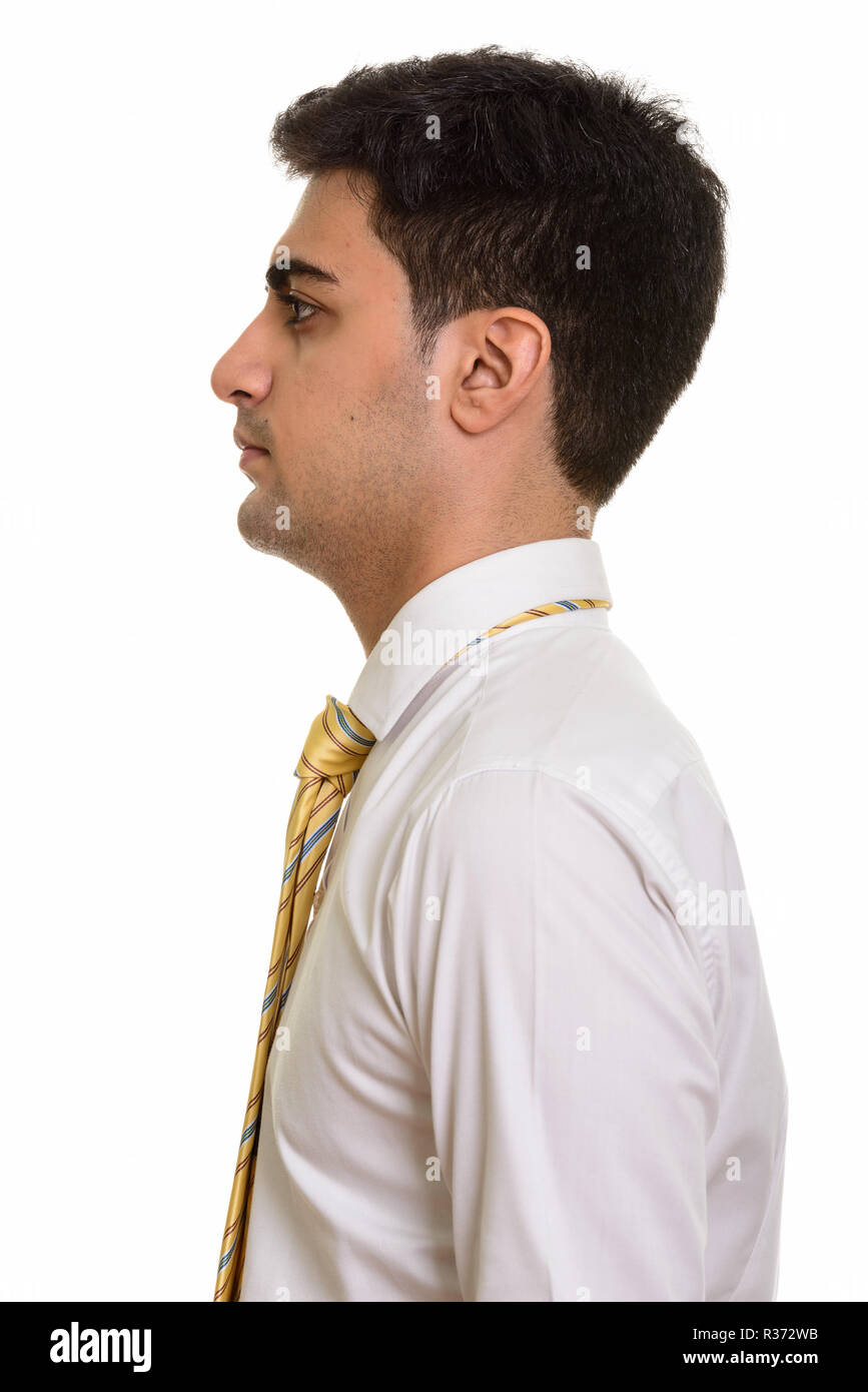 Profile view of young handsome Persian businessman Stock Photo - Alamy