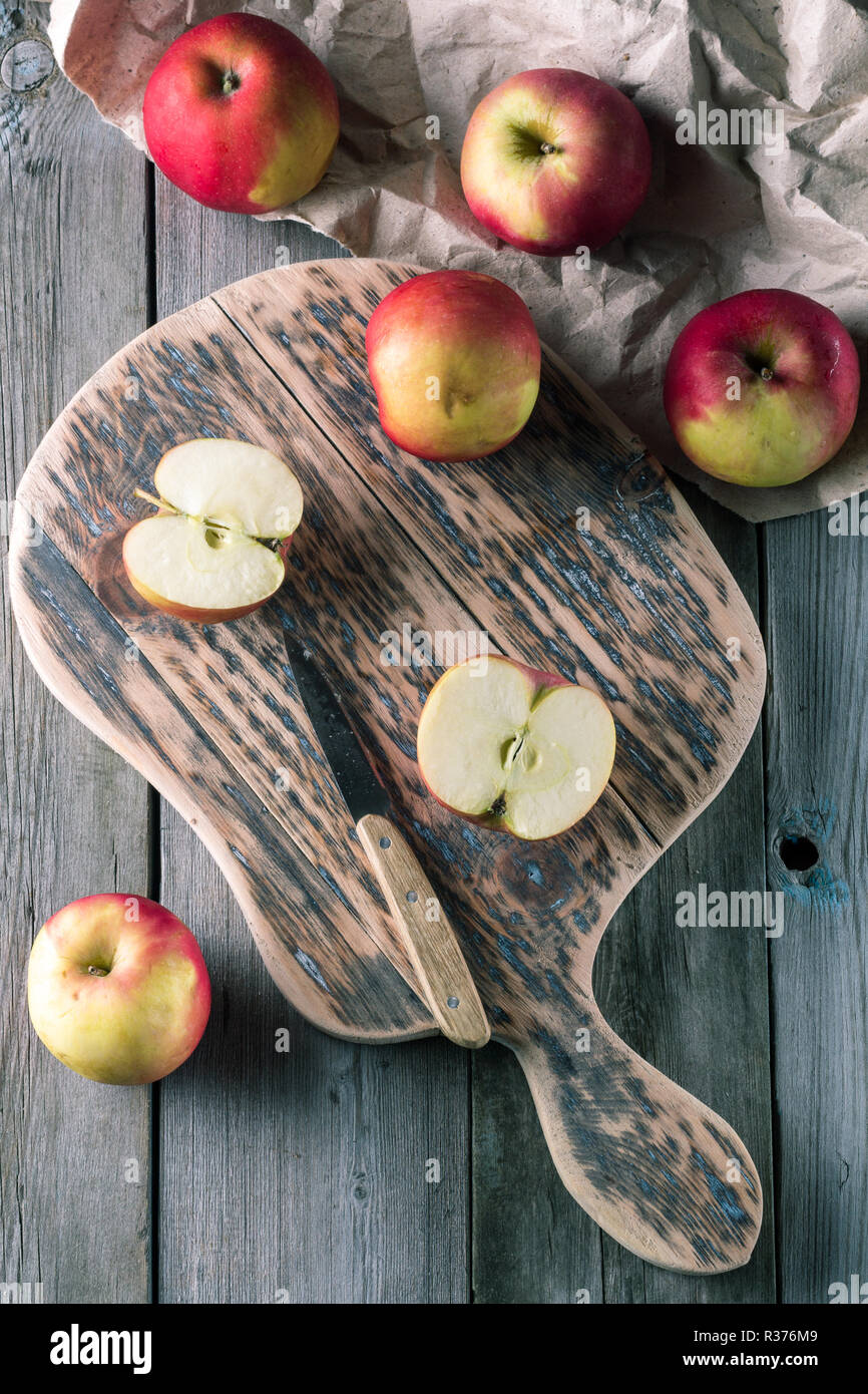 A group of apples on a cutting board Stock Photo - Alamy