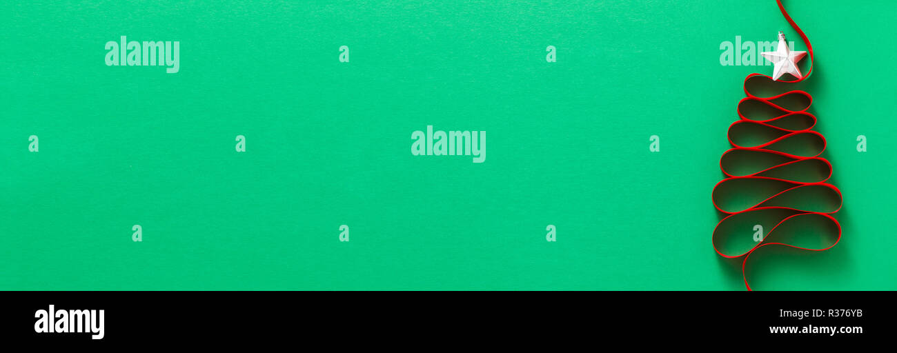 banner of christmas tree made from ribbon on a green background Stock ...