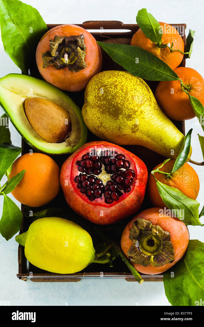 different fruits of pomegranate, pear, mandarin, lemon, avocado and ...