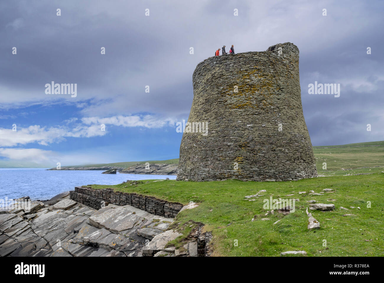 Tourists visiting Mousa Broch, tallest Iron Age broch and one of Europe ...