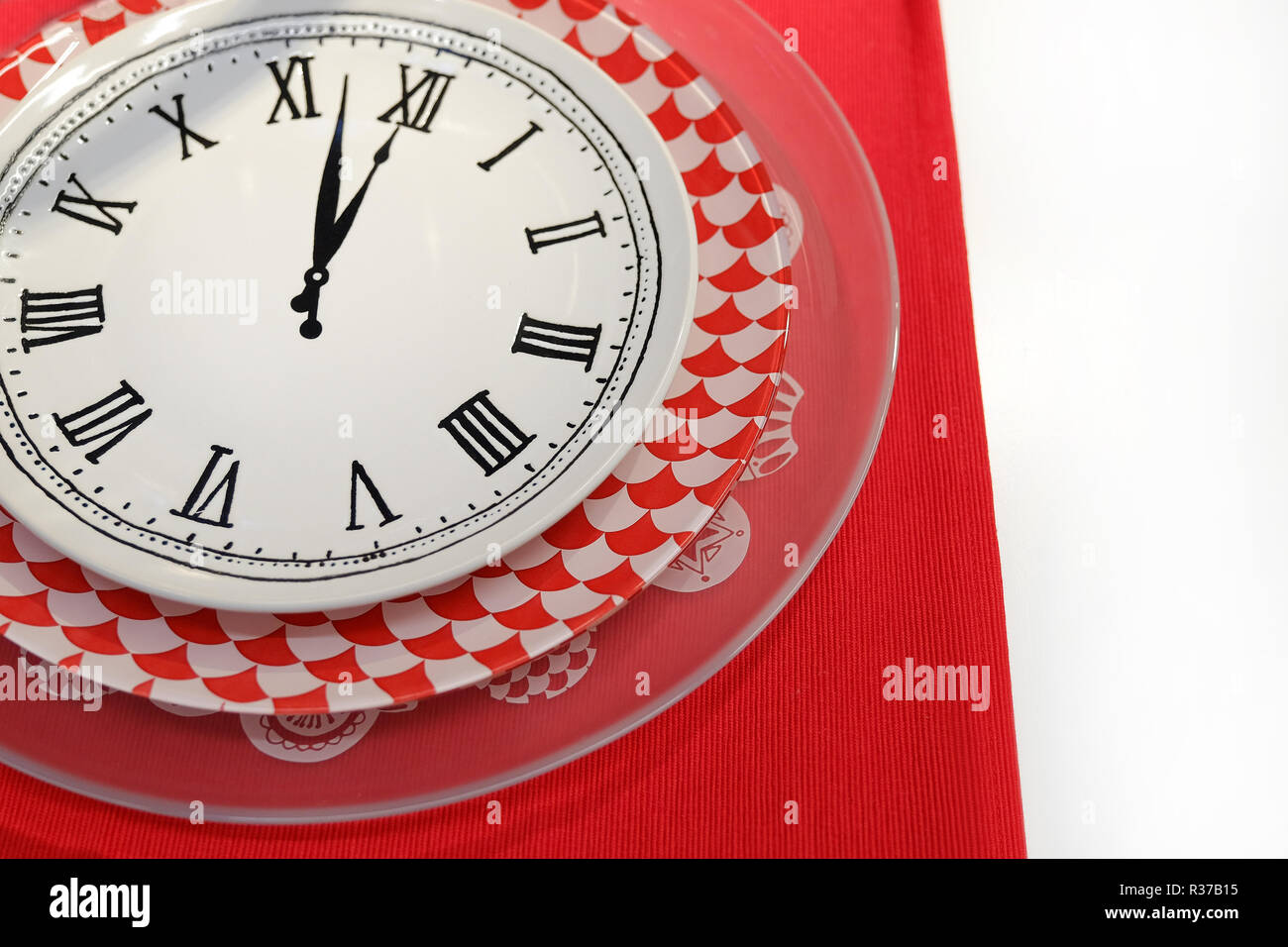 Christmas table on top. Elegant plate, the image of the clock. Roman ...