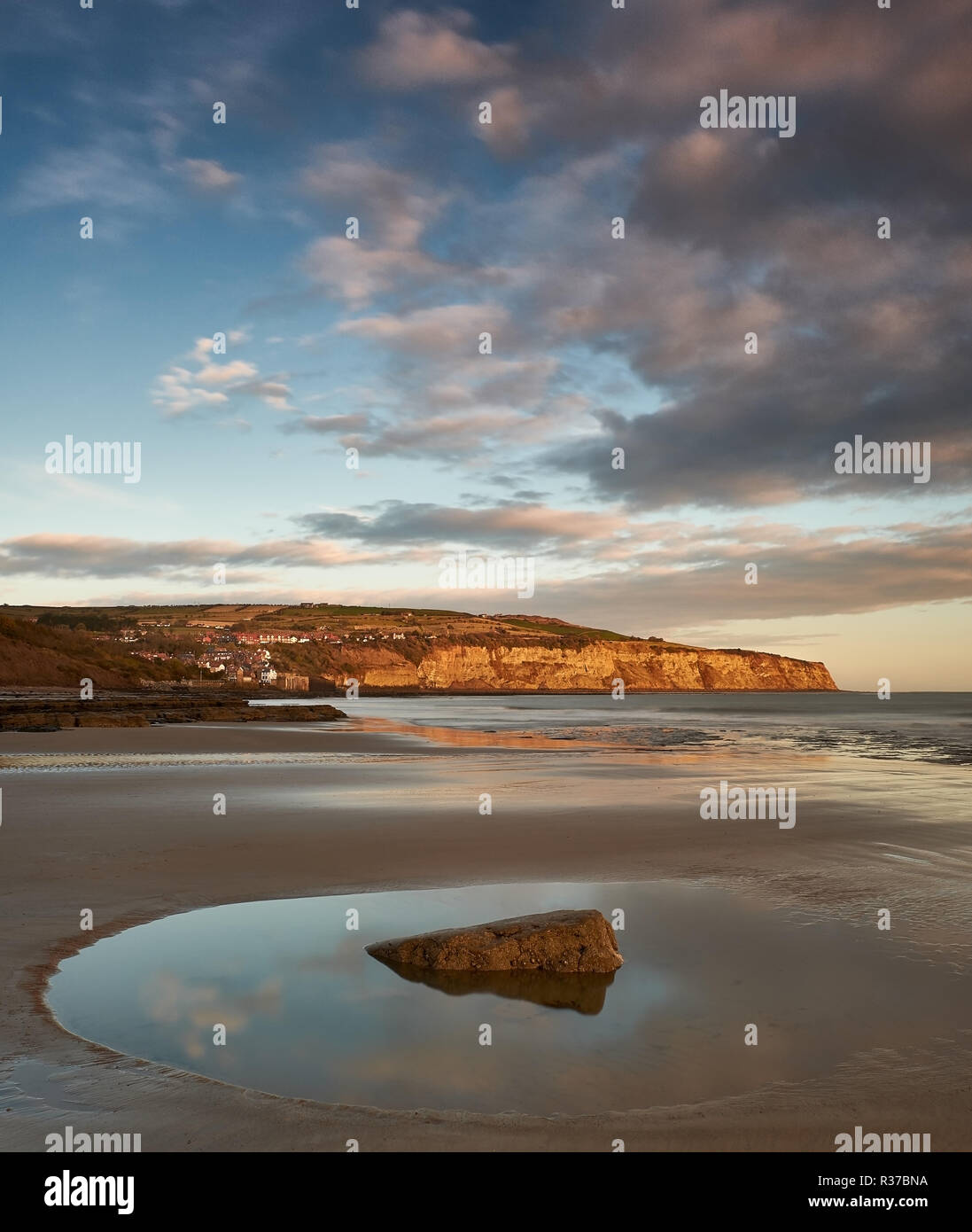 Early morning sunlight illuminates Robin Hood's Bay from Boggle Hole on ...