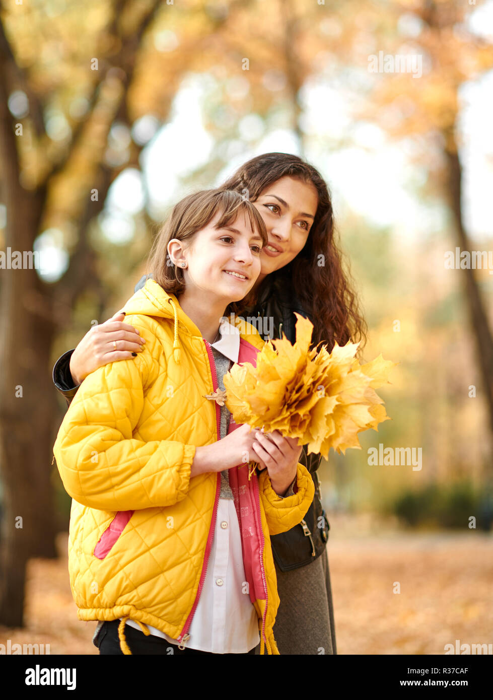 Two girls sister posing in city park hi-res stock photography and ...