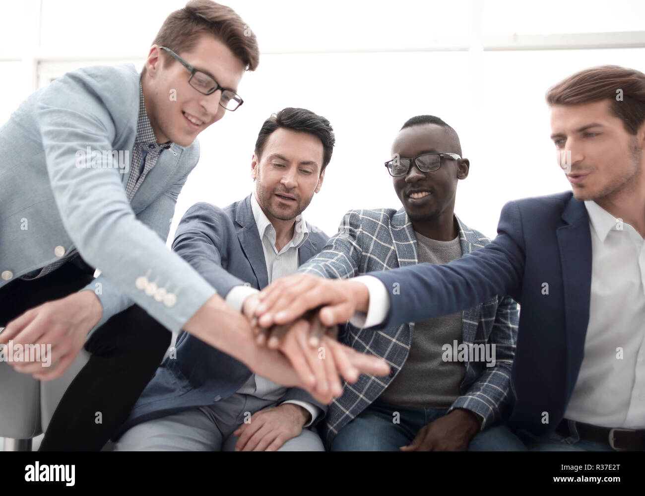 business team putting their hands together Stock Photo - Alamy