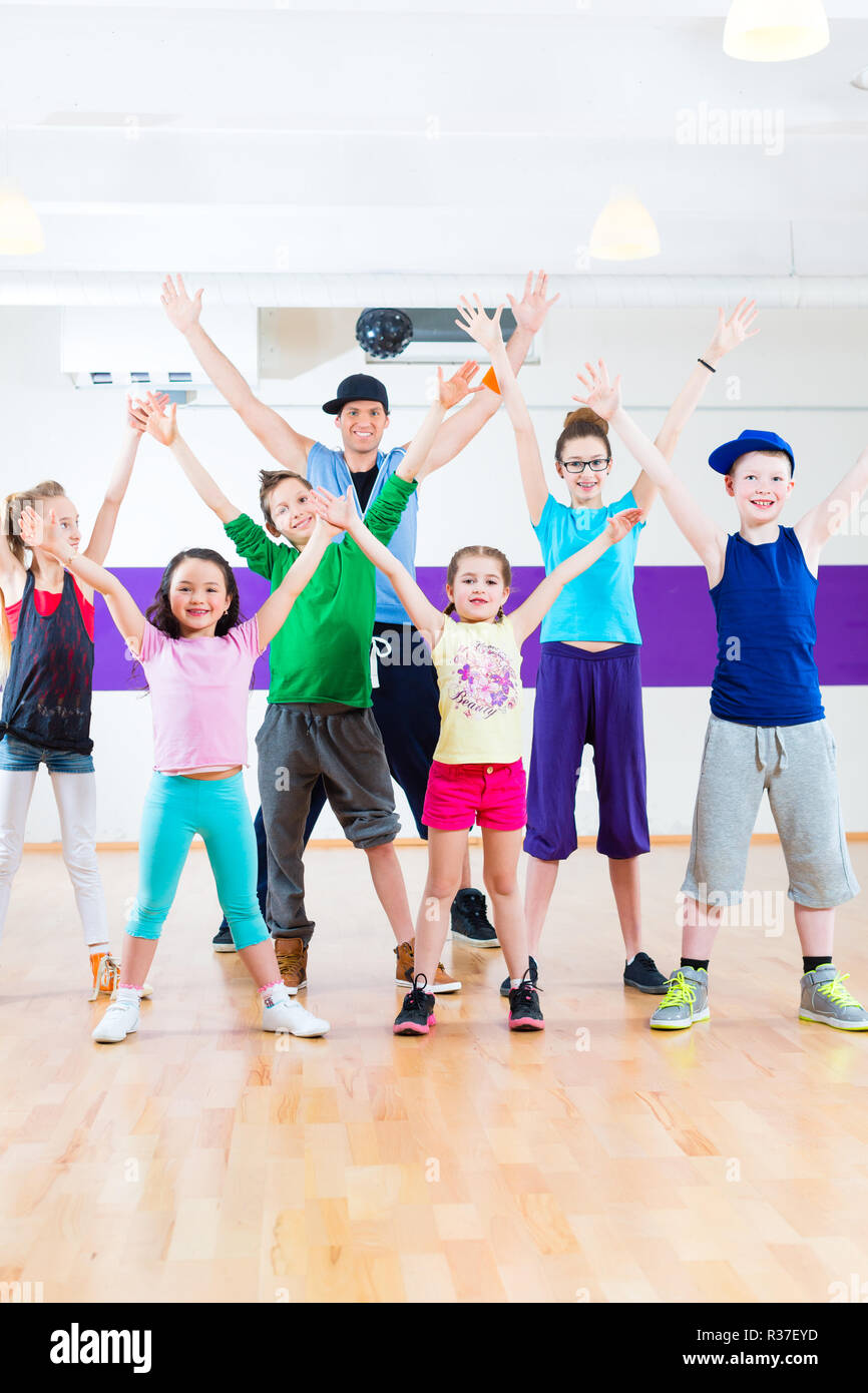 dance teacher gives children dancing zumba fitness in dance studio ...