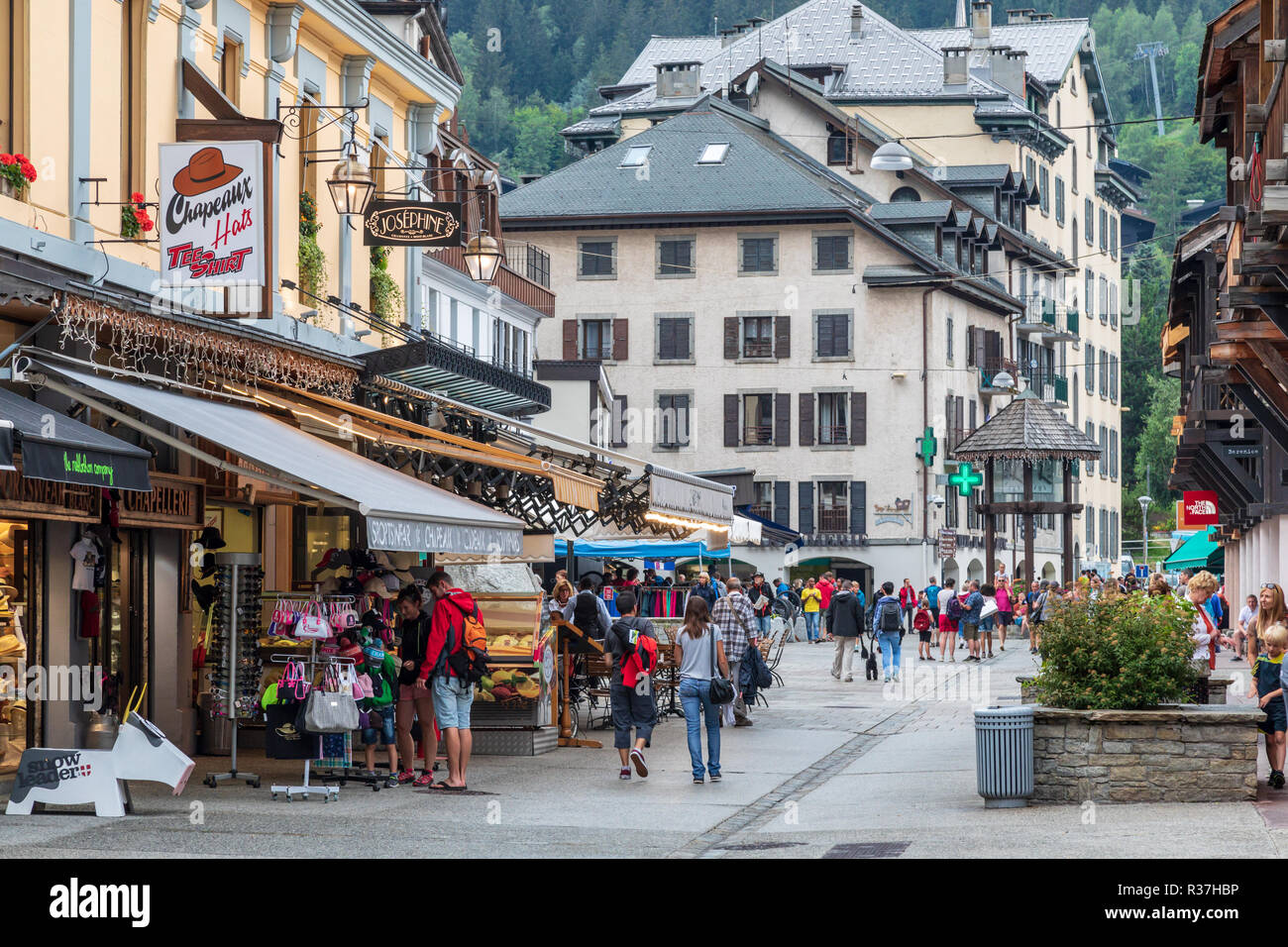 Chamonix main shopping street with tourists visiting the shops and ...