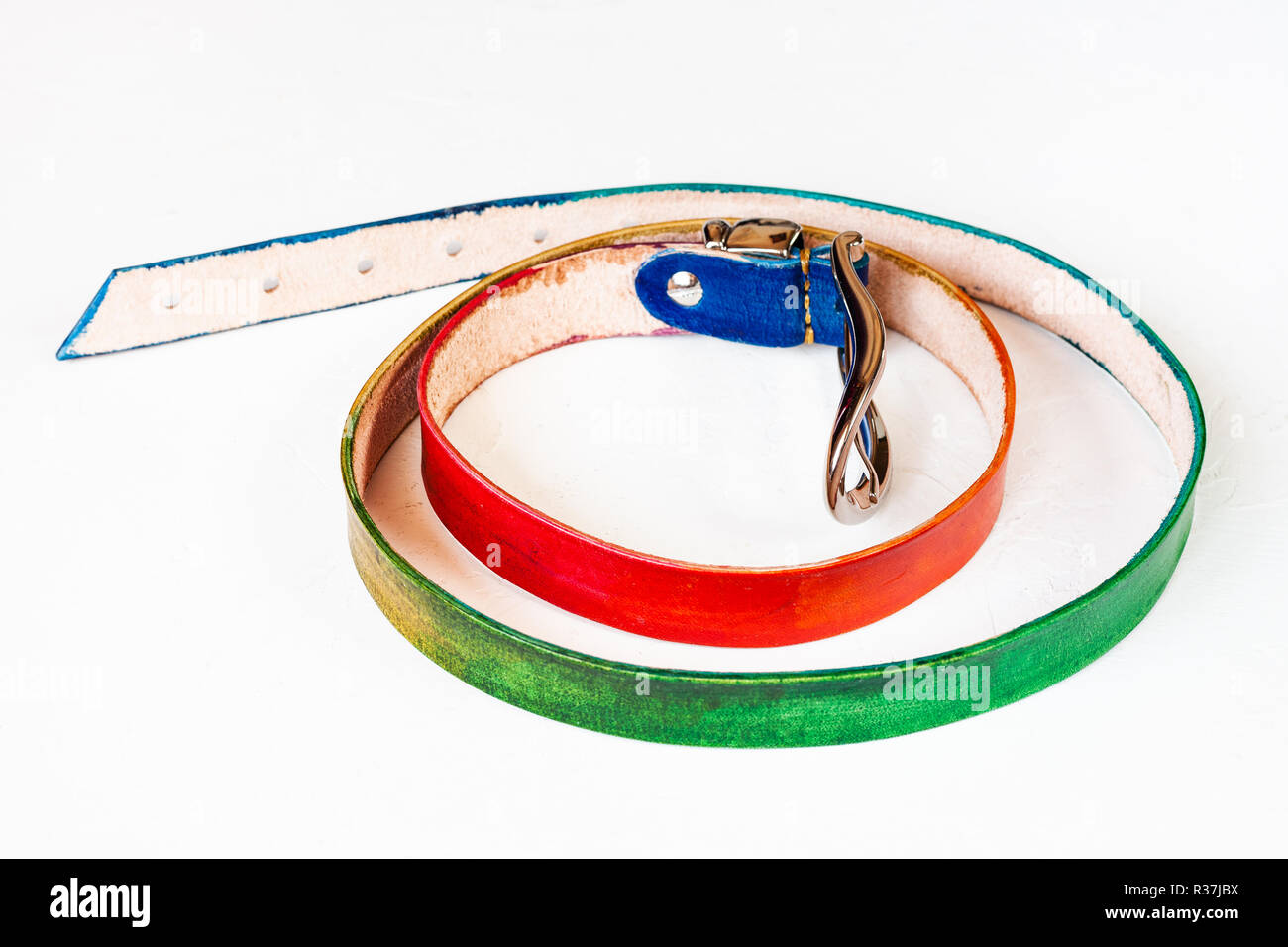 handmade rainbow coloured leather belt on white background Stock Photo ...