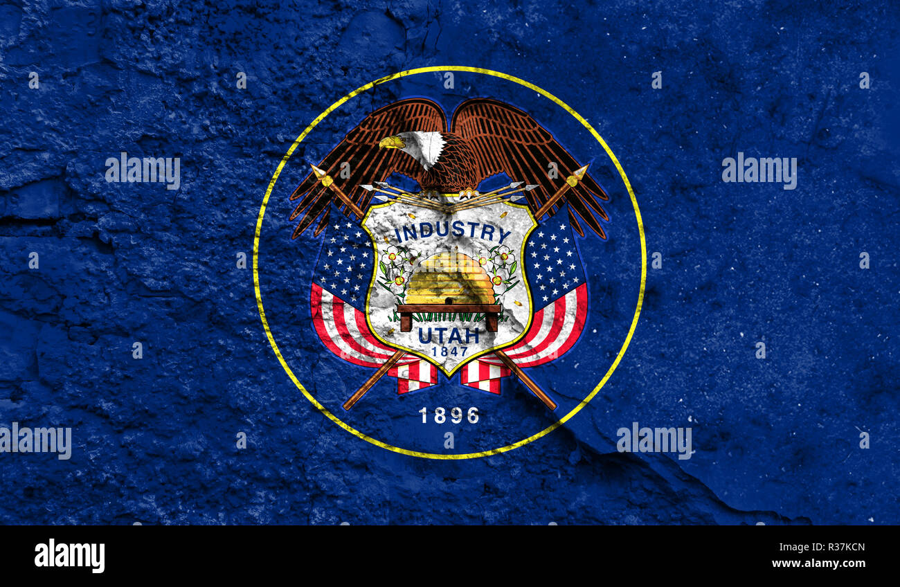 Flag State of Utah close up painted on a cracked wall, concept of armed ...