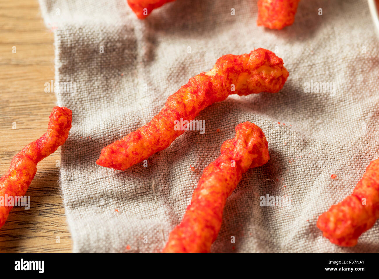 Unhealthy Spicy Cheese Corn Crisps Chips Ready to Eat Stock Photo - Alamy