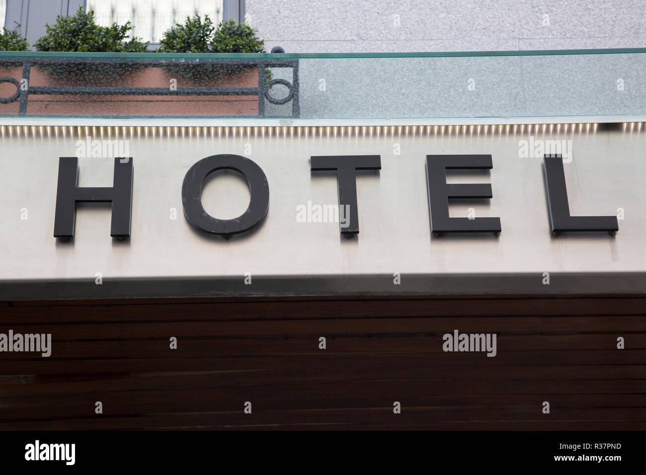 Hotel Sign on Building Facade Stock Photo - Alamy