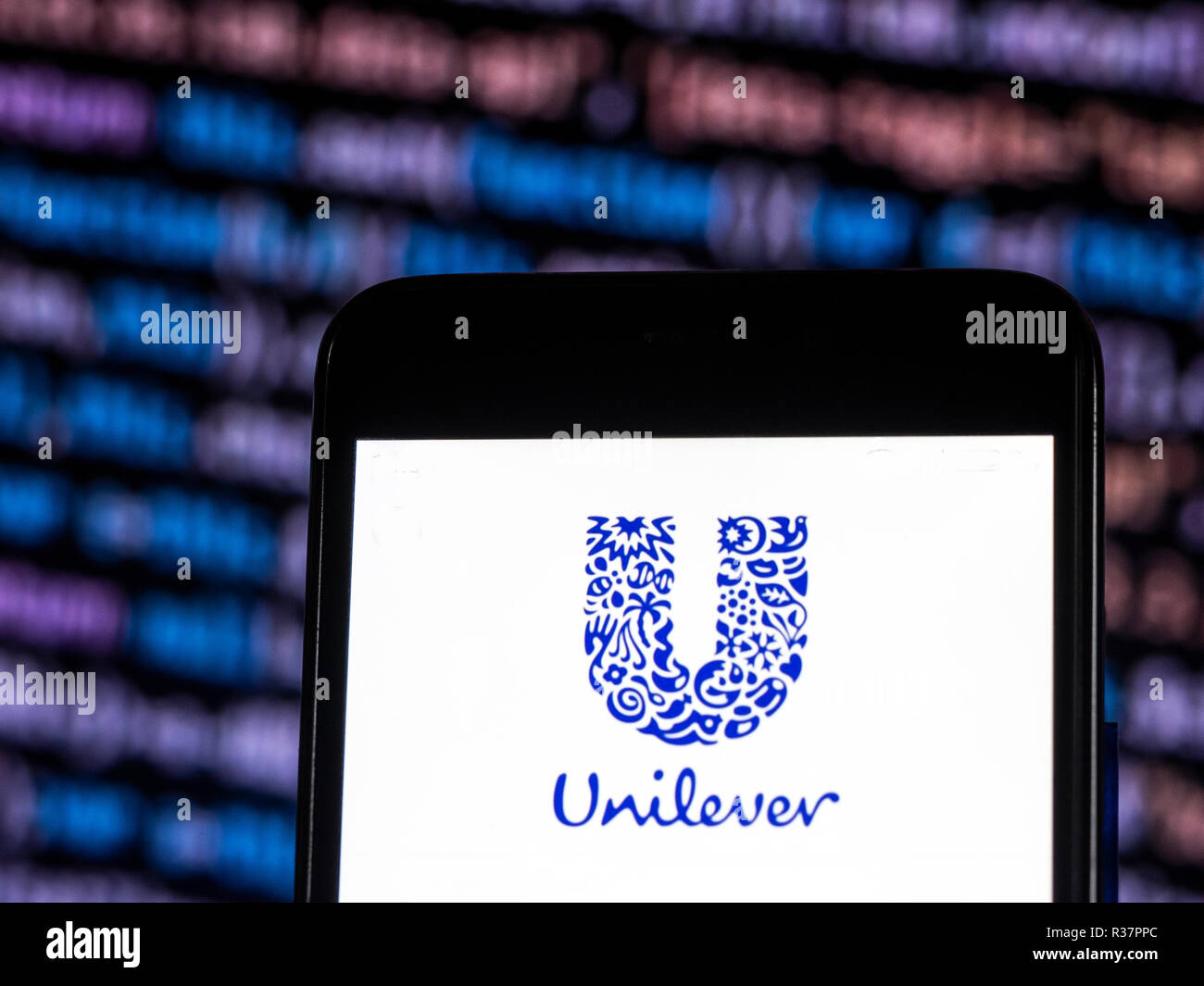 Unilever Company logo seen displayed on smart phone. Unilever is a ...