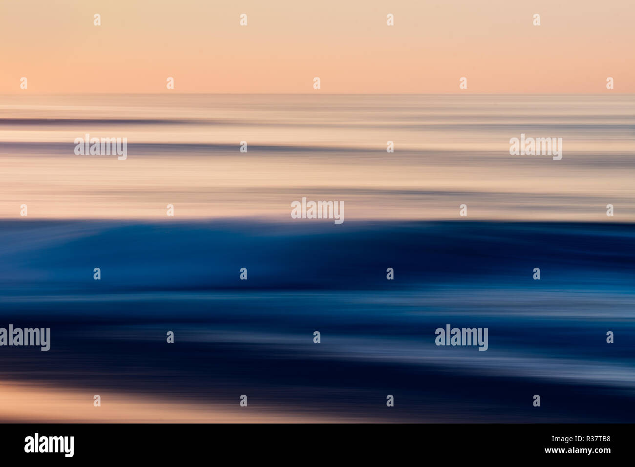 Abstract, ocean waves during sunset Stock Photo - Alamy