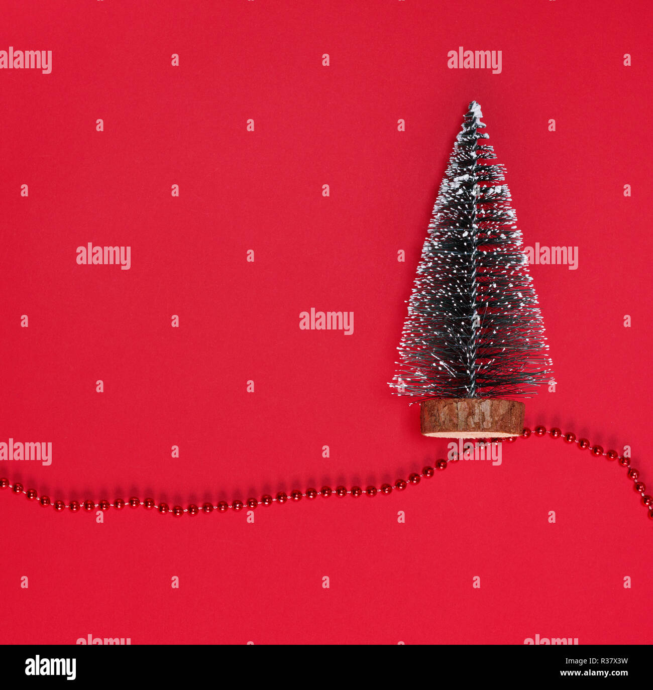 Abstract red christmas background with new year tree and red garland ...