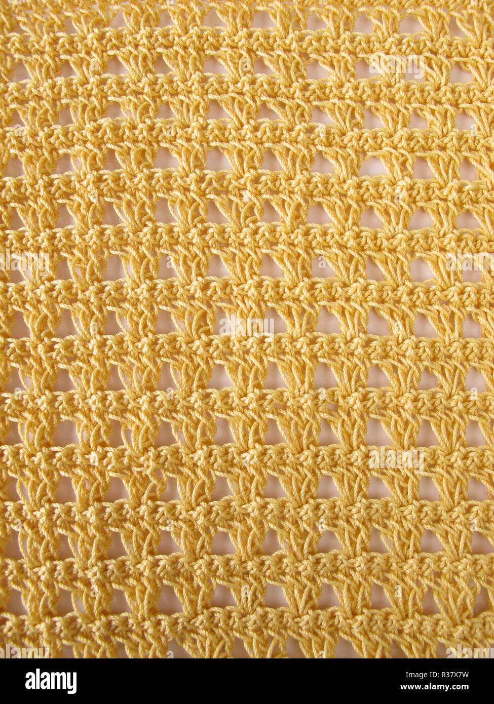 crochet pattern background in yellow Stock Photo - Alamy