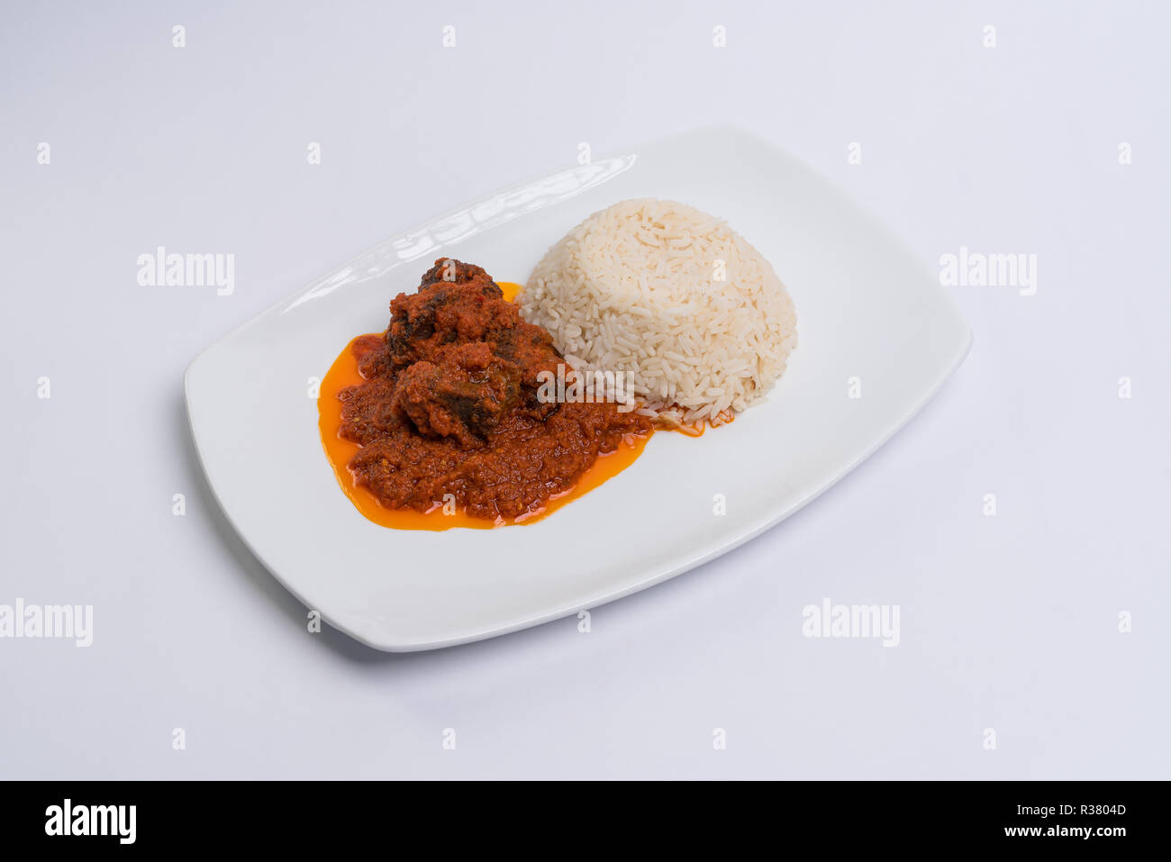 White rice and stew Stock Photo - Alamy