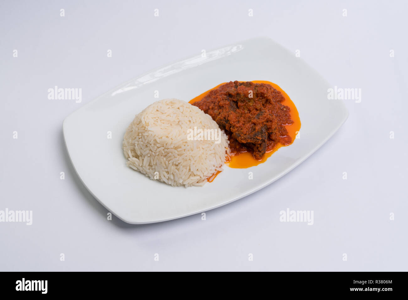 White rice and stew Stock Photo - Alamy