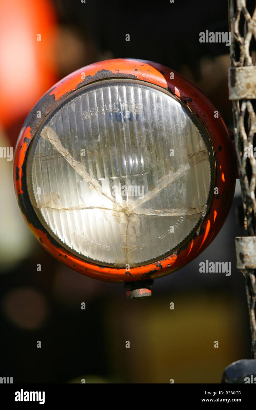 Headlight of an old tractor on display at a country fair. England UK GB ...
