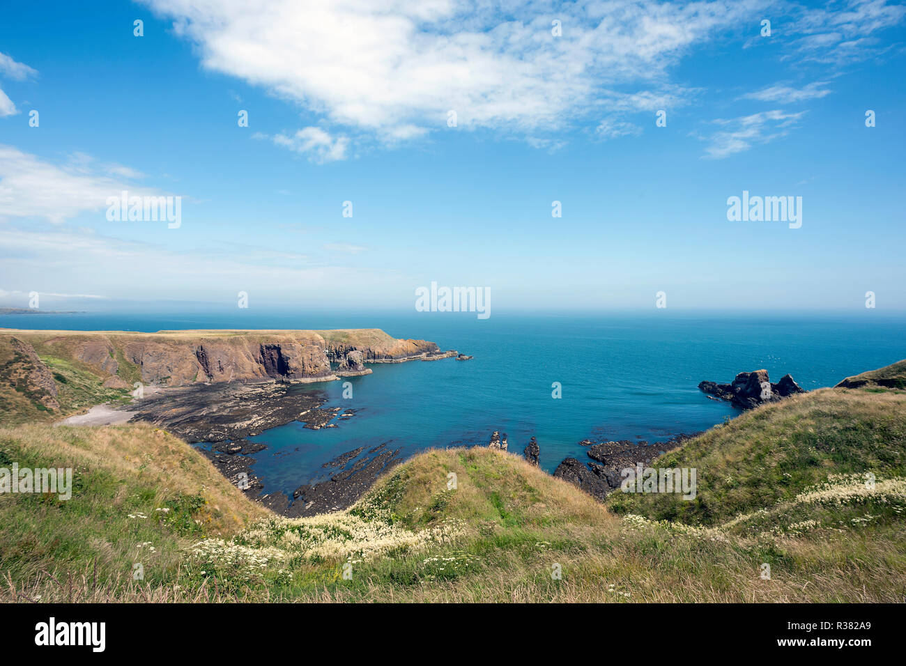 View of Castle Haven Bay, adjacent to Dunnottar Castle from cliff path ...