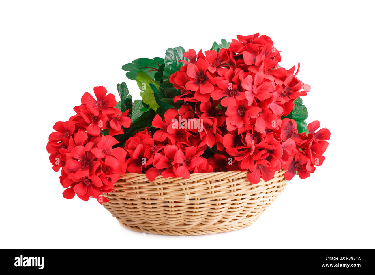 Red fabric flowers in wicker basket isolated on white background Stock ...