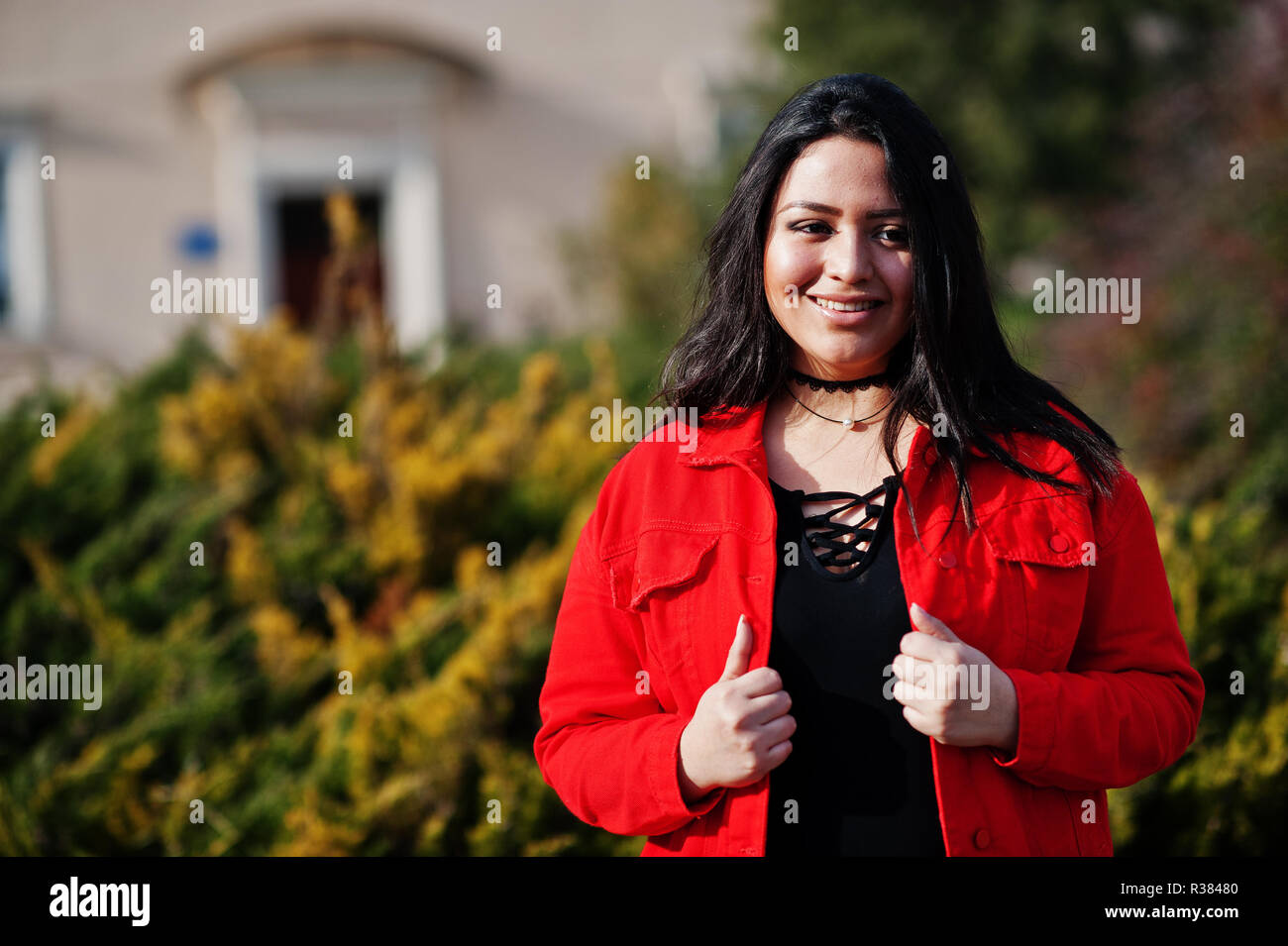 Pretty latino model girl from Ecuador wear on black and red jacket ...