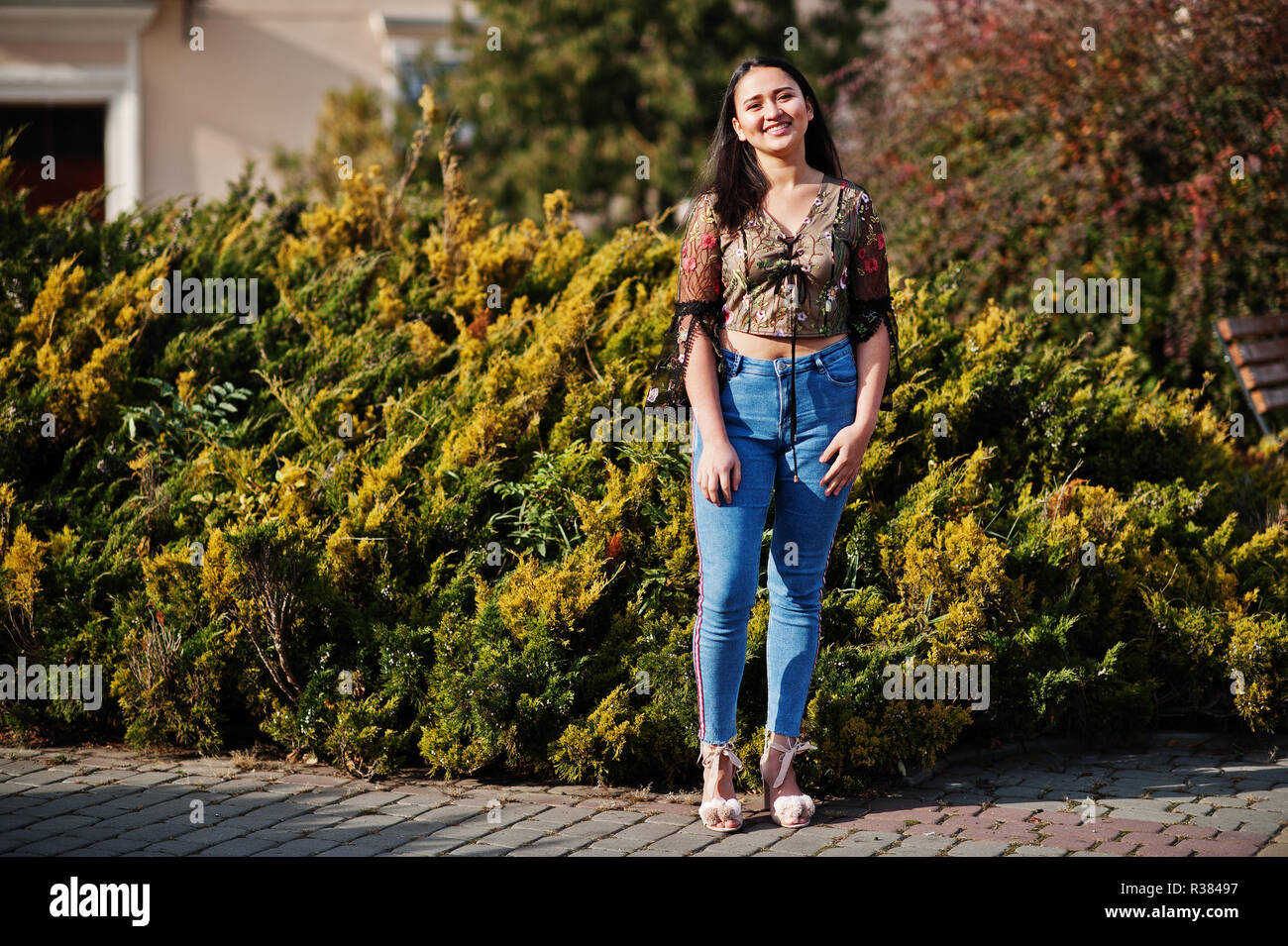 Pretty latino model girl from Ecuador wear on jeans posed at street ...