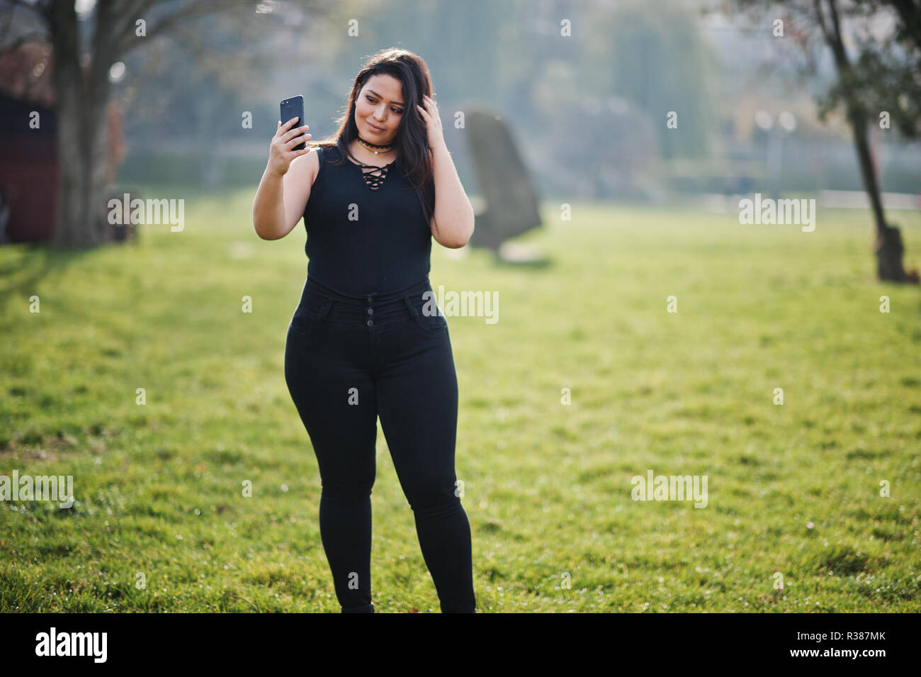 Pretty latino model girl from Ecuador wear on black posed at street ...