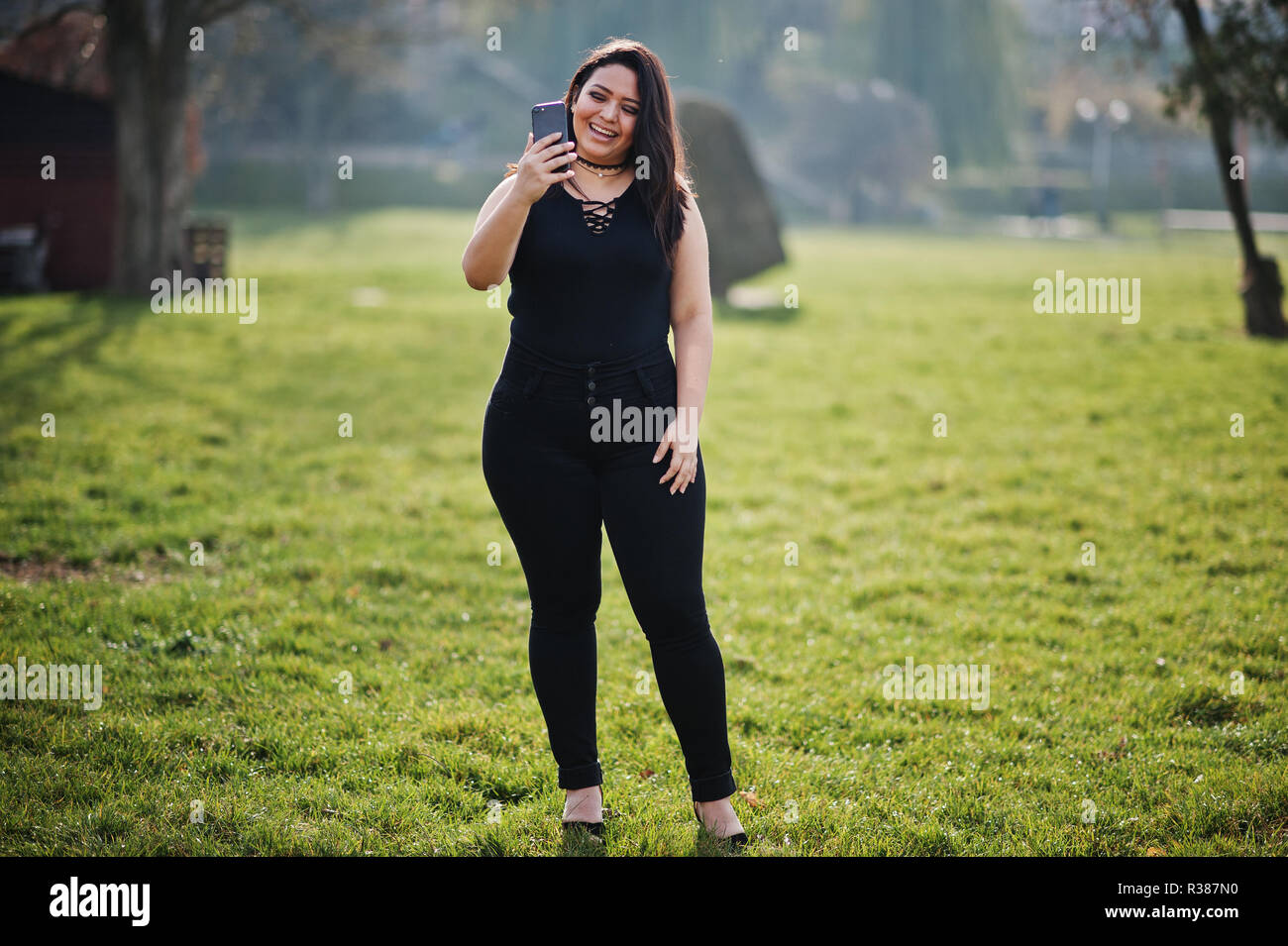Pretty latino model girl from Ecuador wear on black posed at street ...