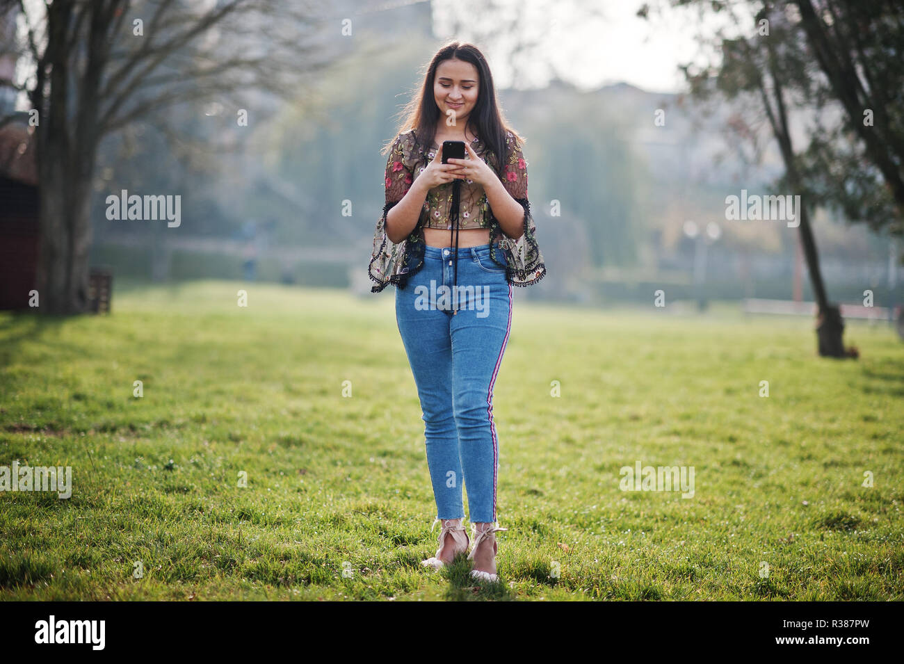 Pretty latino model girl from Ecuador wear on jeans posed at street ...