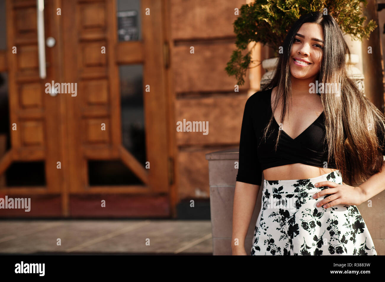 Pretty latino model girl from Ecuador wear on black tops and skirt ...