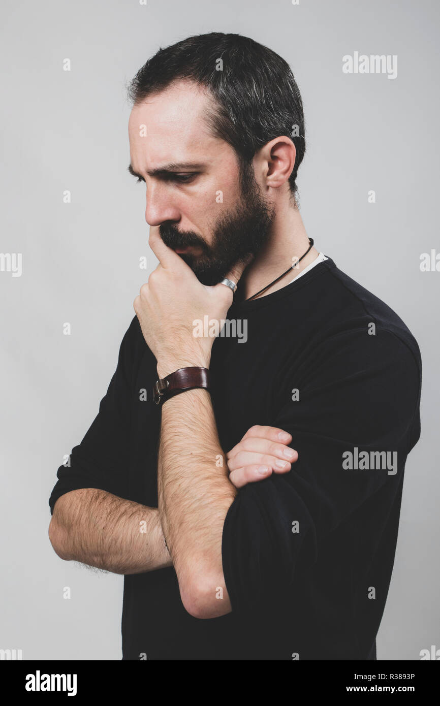 Young sad worried man hi-res stock photography and images - Alamy