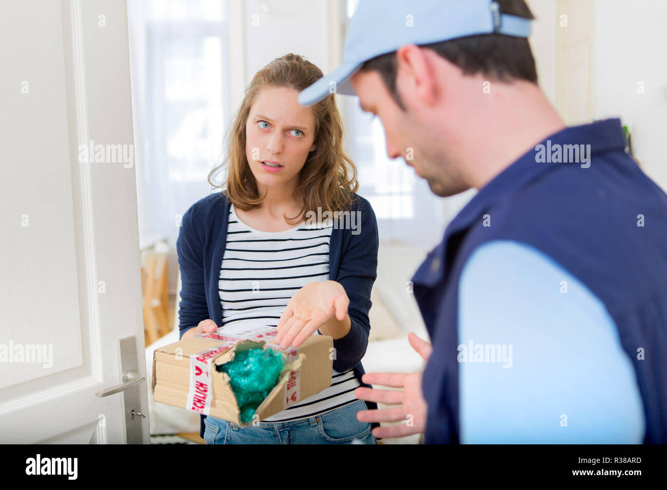 Delivery man parcel damage hi-res stock photography and images - Alamy