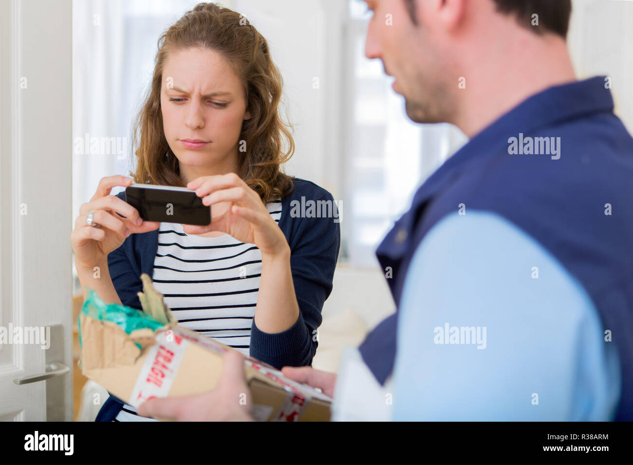 Delivery man parcel damage hi-res stock photography and images - Alamy