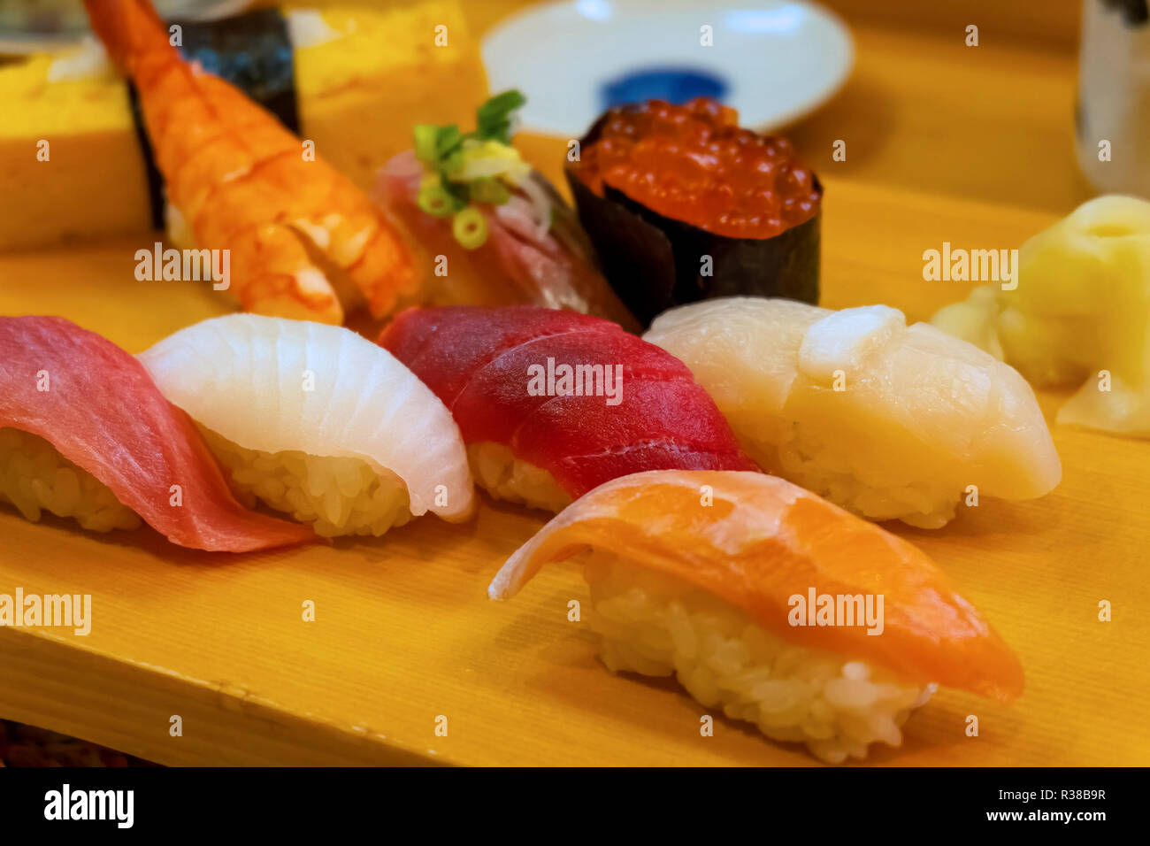 A set of japanese traditional sushi set beautifully decorated on a wood ...