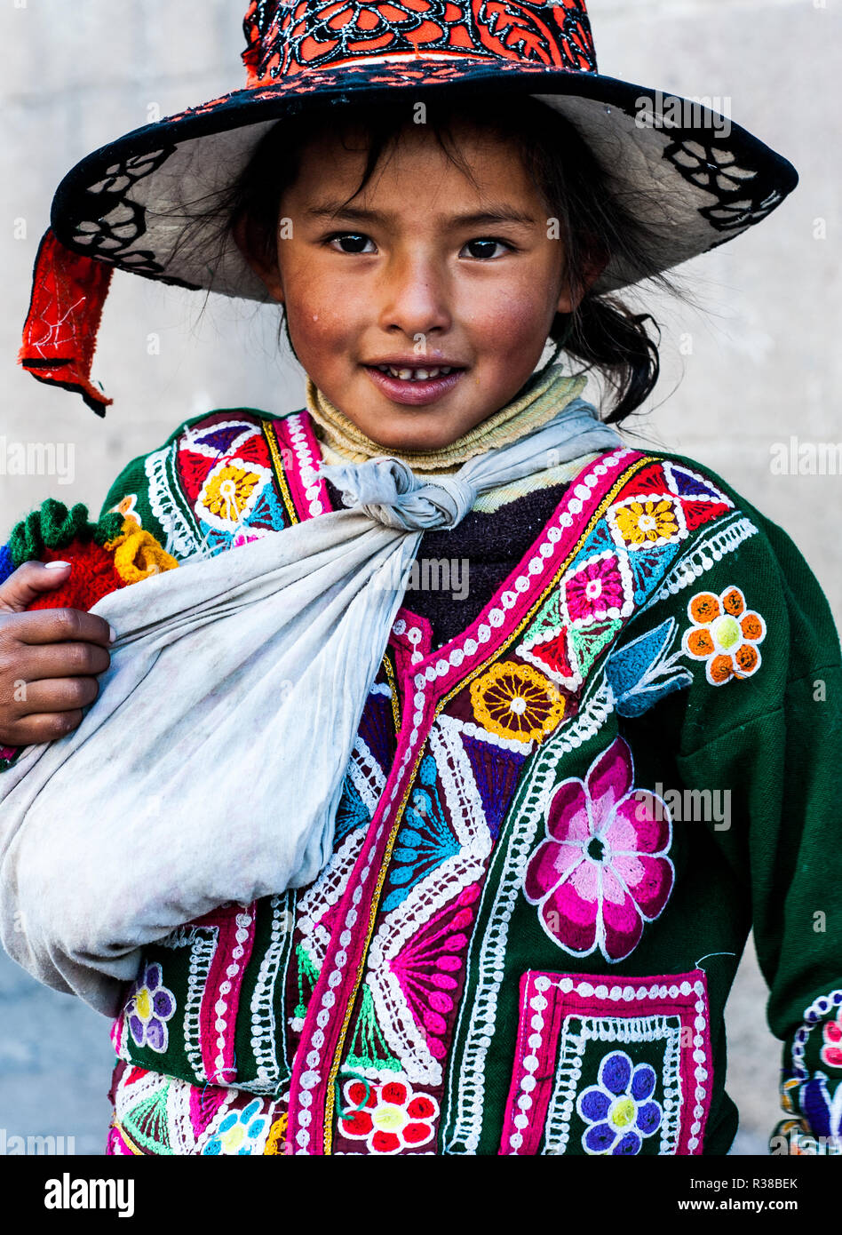 Peruvian girl in traditional dress a posing for a photo in Cusco , Peru ...