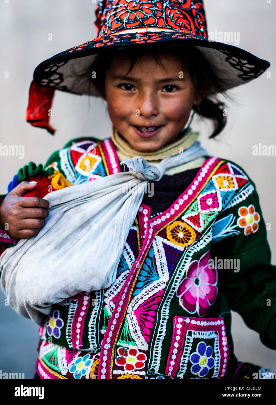 Peruvian girl in traditional dress a posing for a photo in Cusco , Peru ...