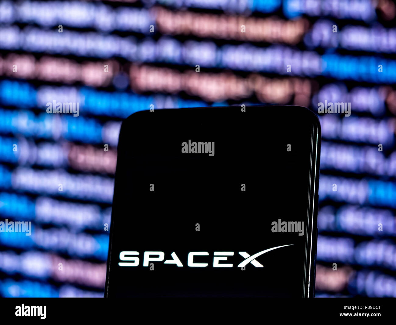 SpaceX Aerospace company logo seen displayed on smart phone. Space ...