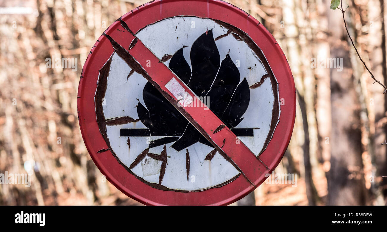Old rusty sign or symbol no campfire, do not light a fire. No open ...