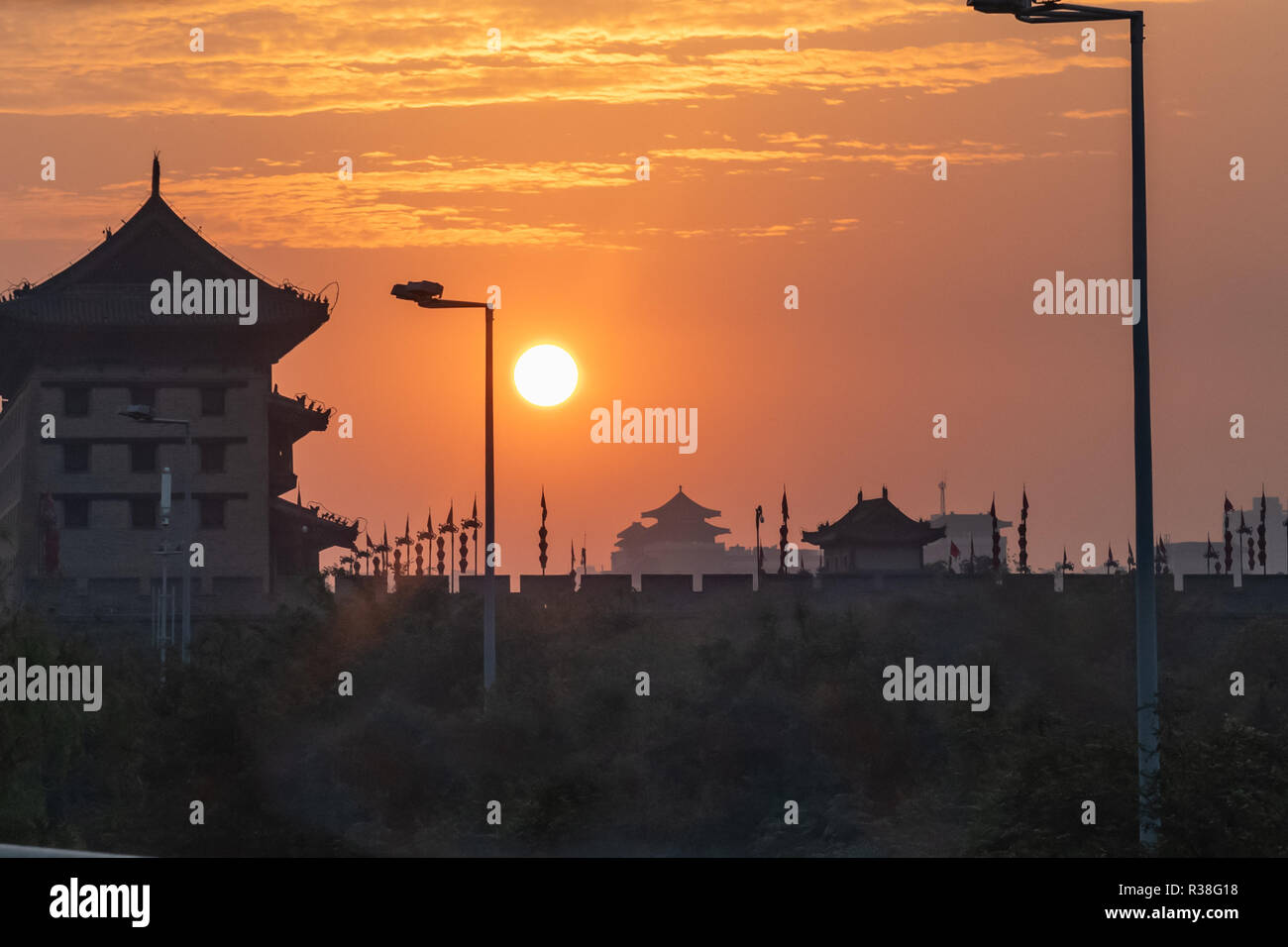 View of Xian city wall at sunrise Stock Photo - Alamy