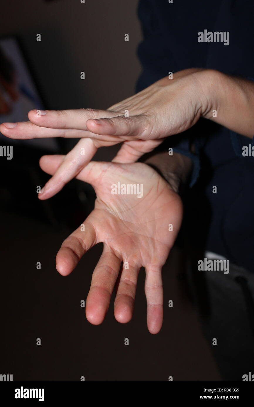 Cracking Knuckles, Female Stock Photo - Alamy