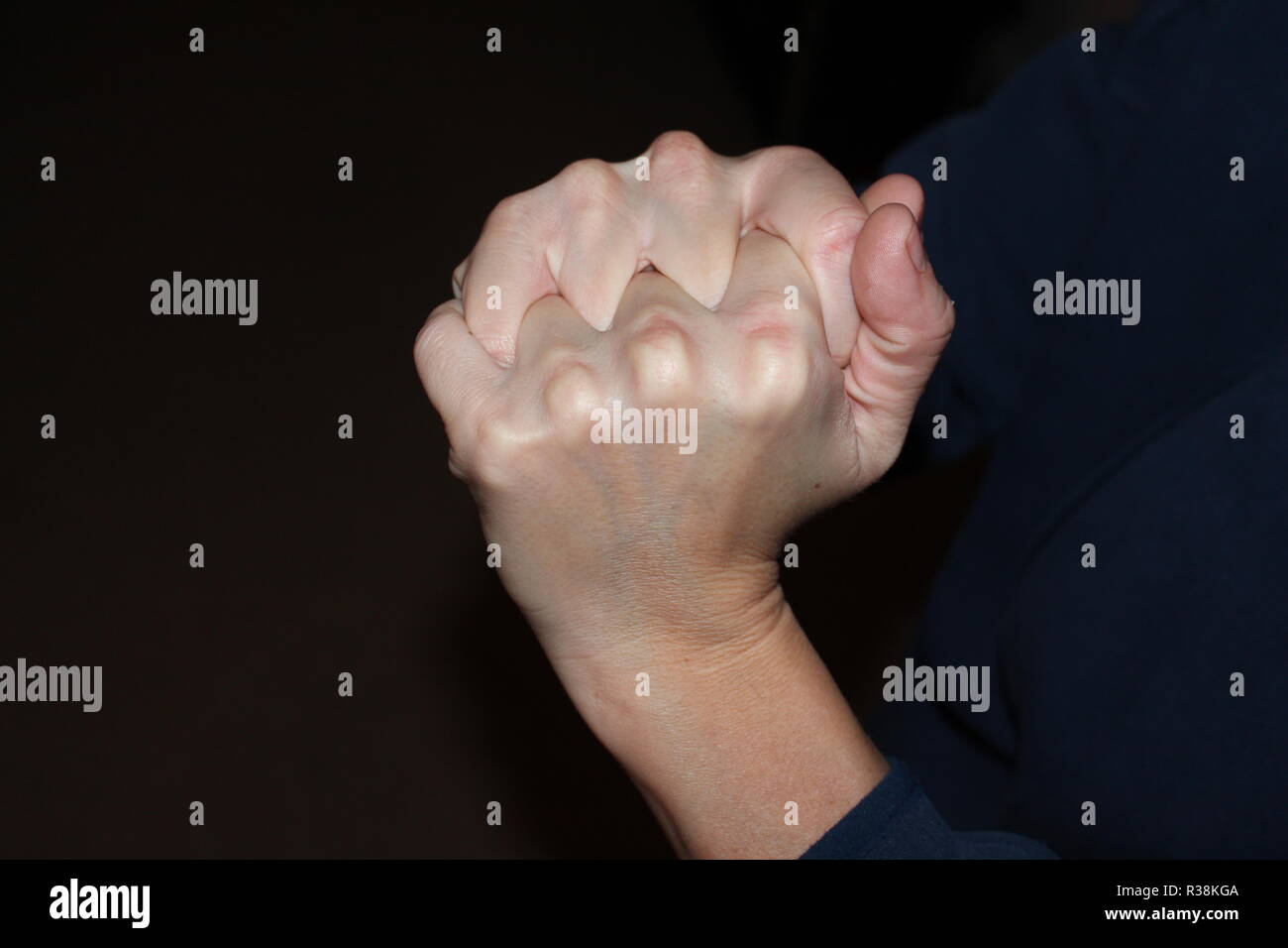Cracking Knuckles, Female Stock Photo - Alamy