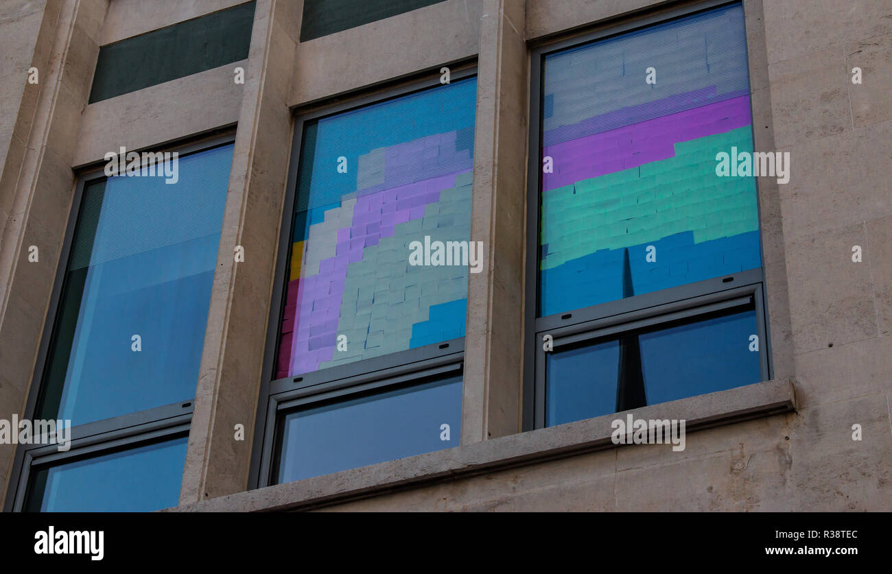 Two windows covered in sticky coloured paper notes Stock Photo - Alamy