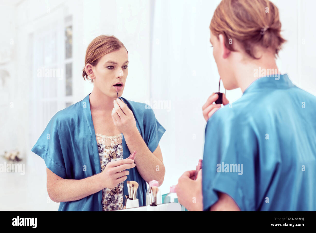 Young attractive transgender man being completely concentrated Stock ...