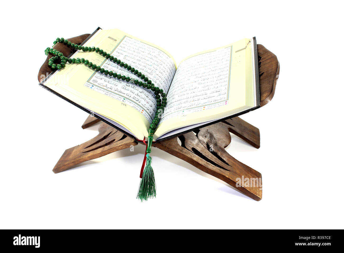 quran stand with open koran and rosary Stock Photo - Alamy