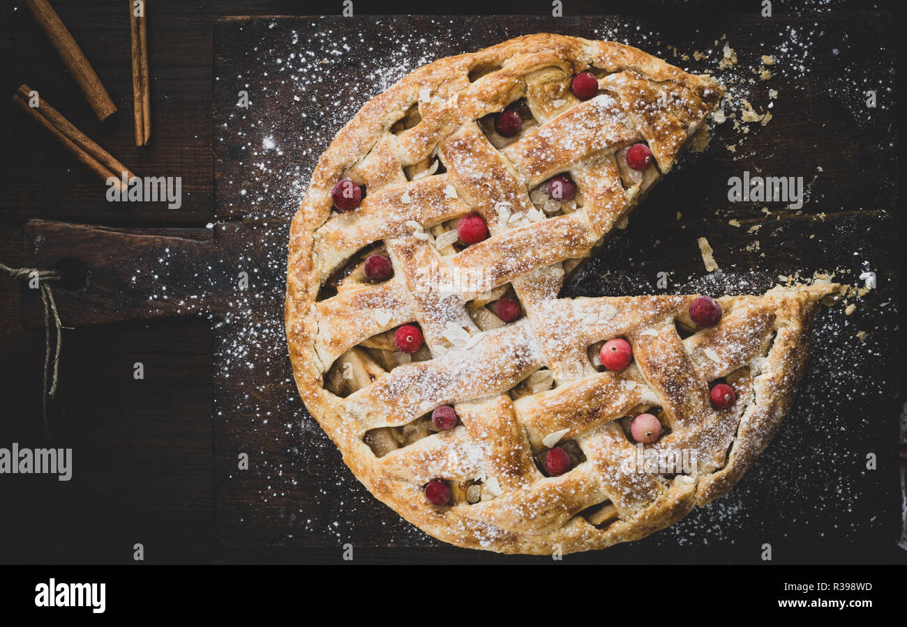 baked round apple pie with one cut piece, top view Stock Photo - Alamy